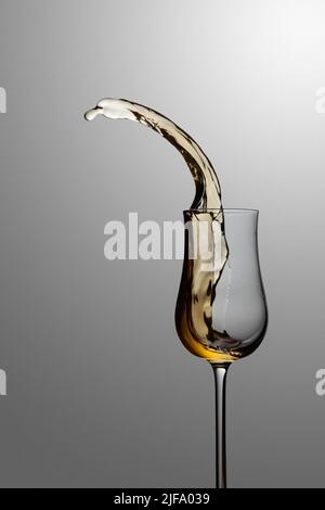 The drink spills out of the glass. Concept of the theme of premium ...