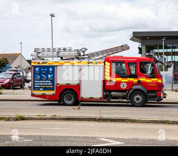 Fire engine driving through Camborne in Cornwall,UK Stock Photo - Alamy