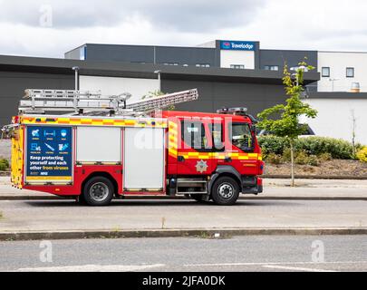 Fire engine driving through Camborne in Cornwall,UK Stock Photo - Alamy