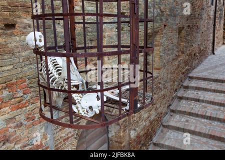 Skeleton in cage, Elice, Italy Stock Photo - Alamy