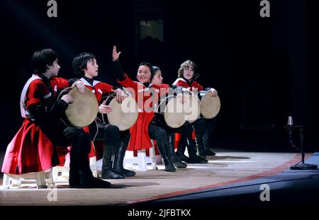 Georgian musicians dressed in national costumes playing folk musical ...