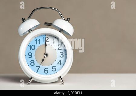 Clock face showing time 7 Seven o clock 0700 1900 hrs Stock Photo - Alamy