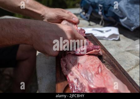 Typical Uruguayan and Argentine Asado Cooked on fire. Entrana and Vacio ...