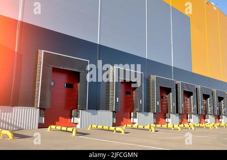 Modern warehouse complex. Warehouse building with many loading gates ...