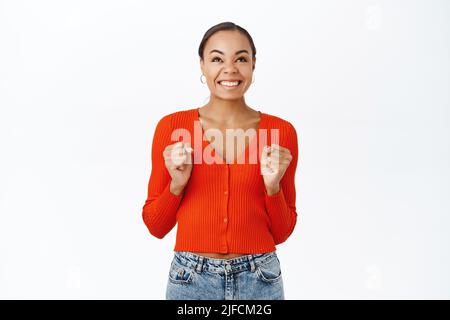 Excited millennial pretty girl jumping with joy and celebration Stock ...