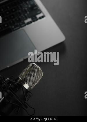 blogger with laptop and microphone audio blogging Stock Photo - Alamy