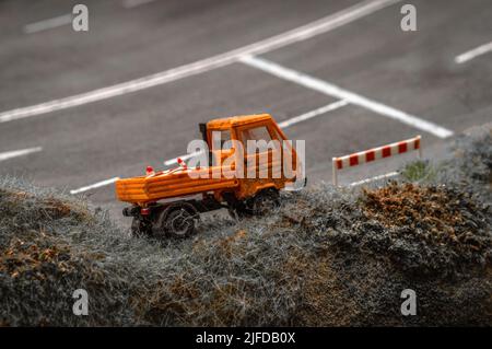 Toy representation of a yellow maintenance truck on the airfield Stock ...