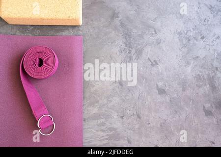 Open yoga mat with cork block and yoga belt. Yoga practice props ...