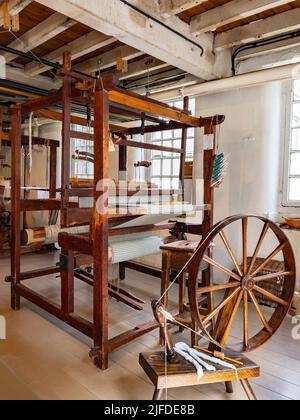 A simple hand-operated loom. A loom is a device used to weave cloth and ...