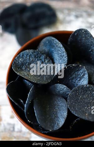 Black food. Black chips. Black food trend. Cuttlefish ink food Stock ...