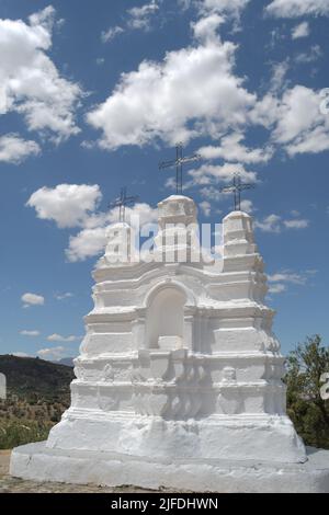 Andalusian village of Monda with clouds in the blue sky, Malaga, Spain ...