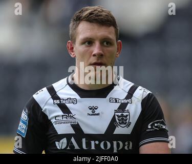 Jordan Lane #13 of Hull FC runs at Ethan Havard #19 of Wigan Warriors ...