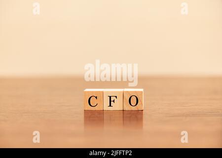 CFO character. CFO. Chief Financial Officer. Written on three wooden ...
