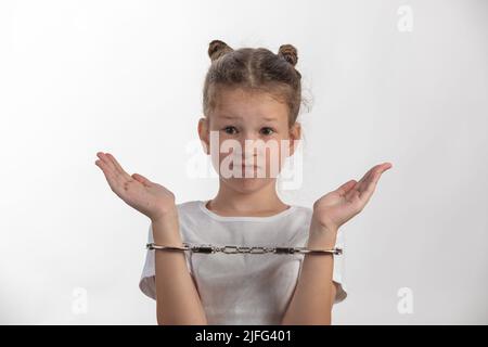 Young female escape artist - girl with handcuffs - a child in trouble ...