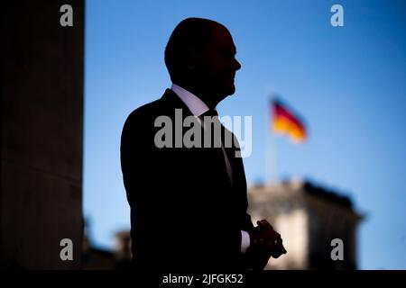 Berlin, Germany. 03rd July, 2022. Chancellor Olaf Scholz (SPD) talks to ...