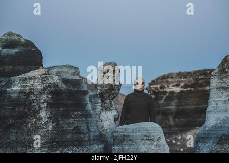 Standing alien mask people in moon style landscape. Concept of ...
