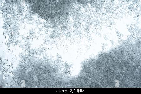 Snow creating texture on the glass. Structure of snow flakes and ice ...