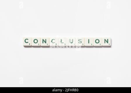 Conclusion formed of scrabble blocks on white background Stock Photo ...
