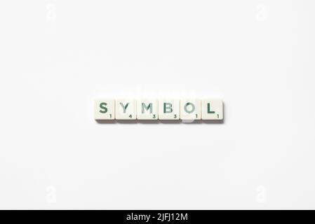 Symbol formed of scrabble blocks on green background Stock Photo - Alamy