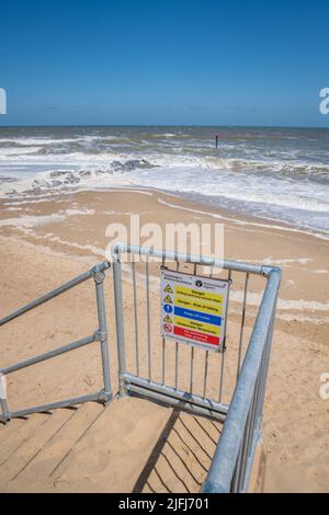 Enviromental agency warning and danger sign at Horsey Gap sea defences ...