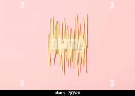 Wooden toothpicks on pink background, flat lay Stock Photo - Alamy