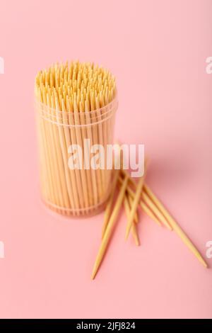 Box with toothpicks on pink background Stock Photo - Alamy