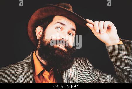 Cheerful smiling gentleman takes off hat in salutation isolated at ...