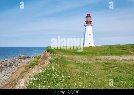 The Low Point Lighthouse is located near New Victoria Nova Scotia and ...