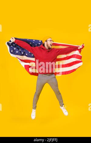 Handsome man with USA flag on red background Stock Photo - Alamy
