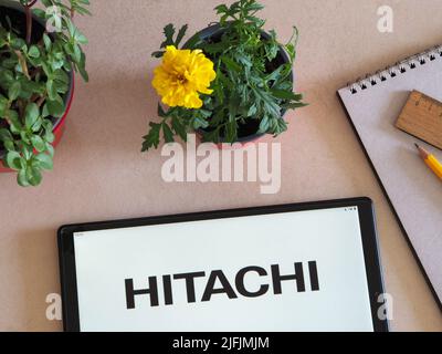 In this photo illustration Hitachi Ltd. logo seen displayed on a tablet ...