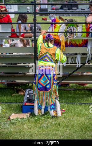 Calgary, Alberta - July 1, 2022: Indigenous dancers preparing for a ...