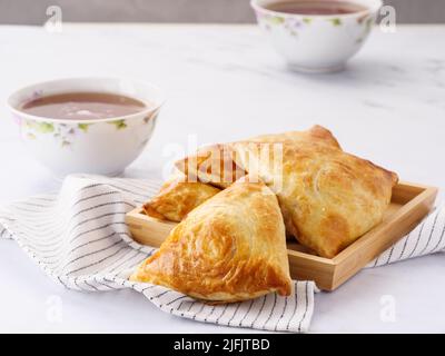 Uzbek national dish samsa or samosa with meat or vegetables and pumpkin ...