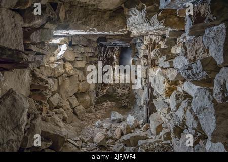 A gallery of old limestone mine illuminated by counter light Stock ...