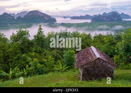View of bamboo hut and mangrove forest at Cempedak Private Island ...