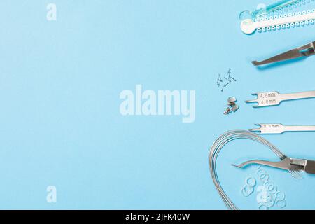 a set of special tools for an orthodontist to install braces for a ...