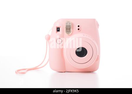 The pink instant camera over white background Stock Photo - Alamy