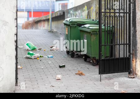 dumpsters on messy city street or courtyard Stock Photo - Alamy