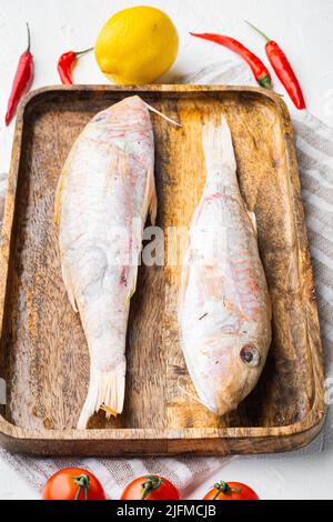Raw fresh mullet or barabulka whole fish set, with ingredients and ...
