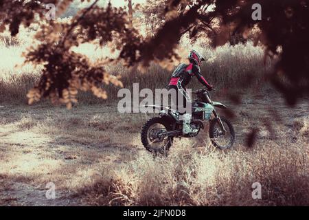Ukrainian professional motorcycle rider driving on Enduro motorbike ...