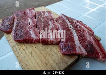 Typical Uruguayan and Argentine Asado Cooked on fire. Entrana and Vacio ...