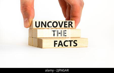 Uncover the facts symbol. Concept words Uncover the facts on wooden ...