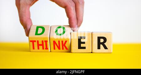 Doer or thinker symbol. Concept words Doer or thinker on wooden cubes ...