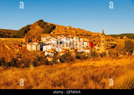 The village of Monterde, highlights the Mudejar tower of the church of ...