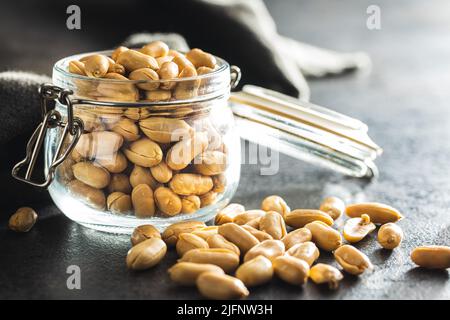 Roasted peeled peanuts in a jar Stock Photo - Alamy
