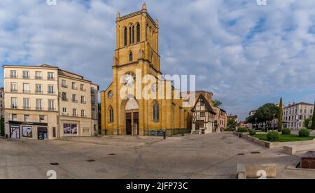 Aerial view of downtown Roanne in France with yellow church, old castle ...