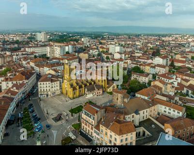 Aerial view of downtown Roanne in France with yellow church, old castle ...
