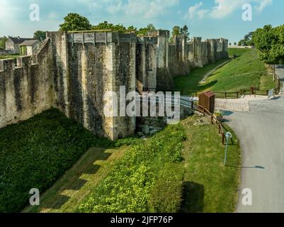 Stone ramparts with towers, gate towers, moat in medieval Provins ...