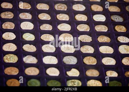 Coinage of ancient Roman coins made of metal on a retro press ...