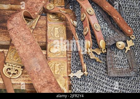 Ancient Roman retro chain mail made of metal plates and a dagger in a ...