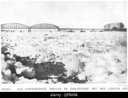 Frozen River De Waal with railway bridge Stock Photo - Alamy